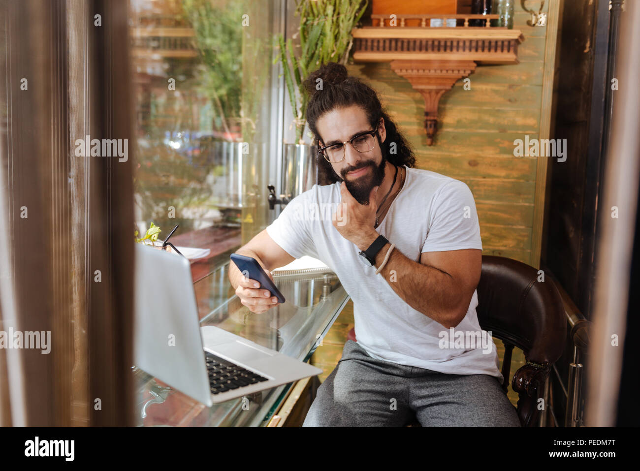 Pleasant handsome man touching his chin Stock Photo - Alamy