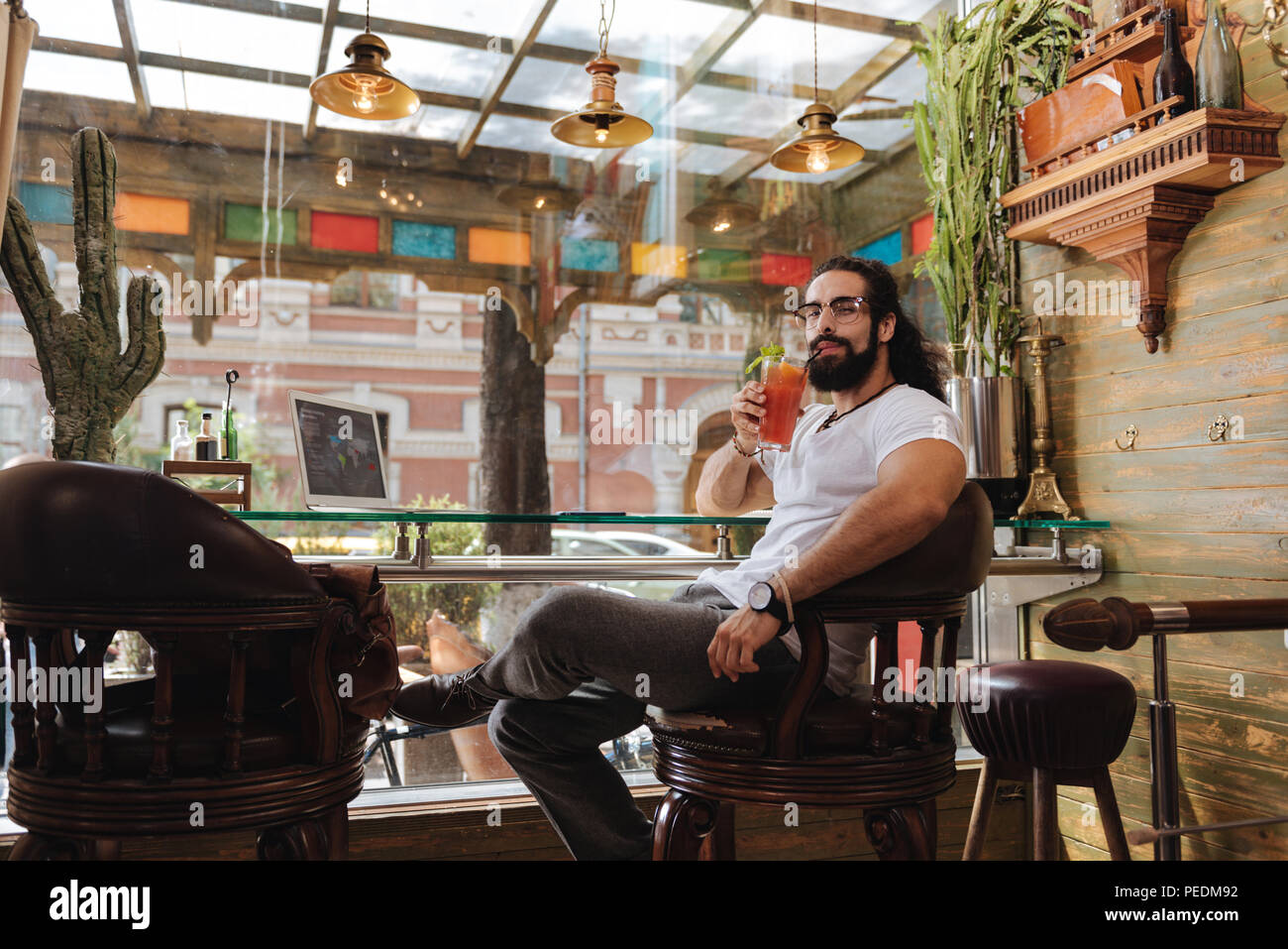 Nice handsome man relaxing in the cafe Stock Photo - Alamy
