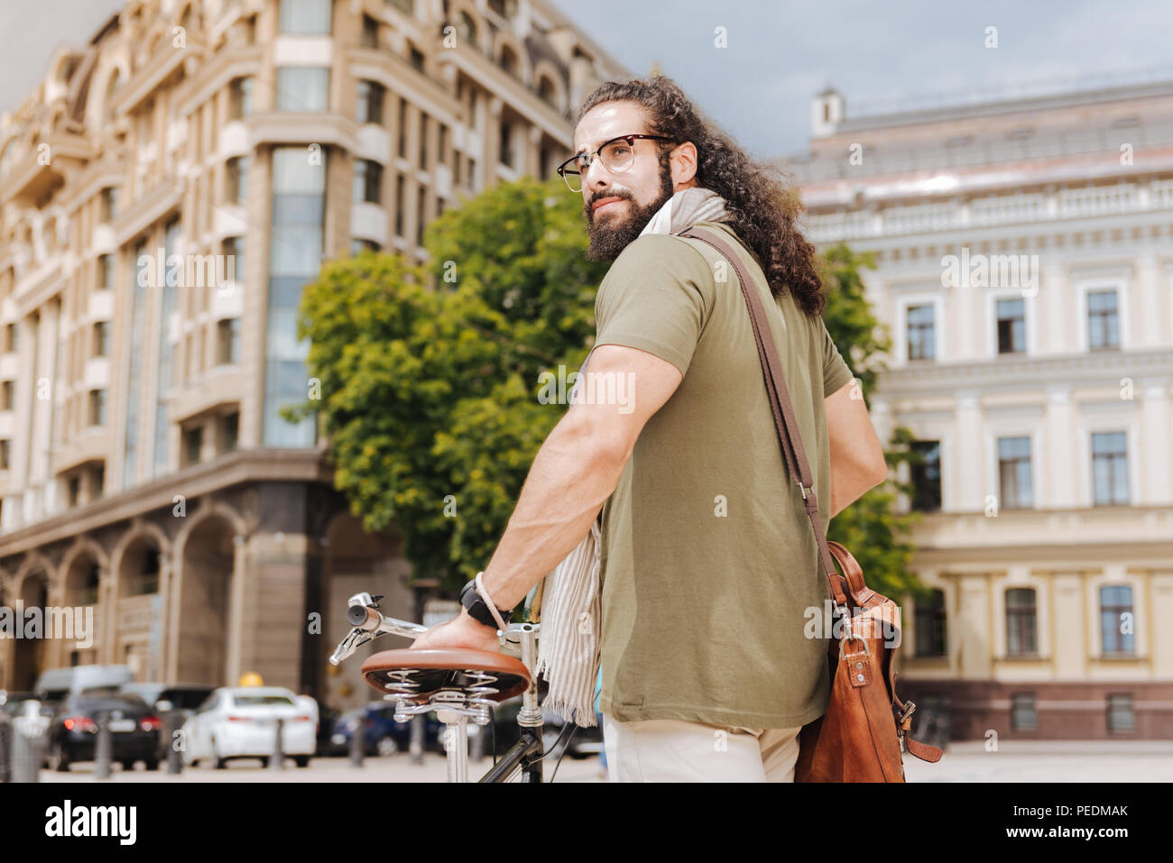 Pleasant nice man looking at the street Stock Photo - Alamy