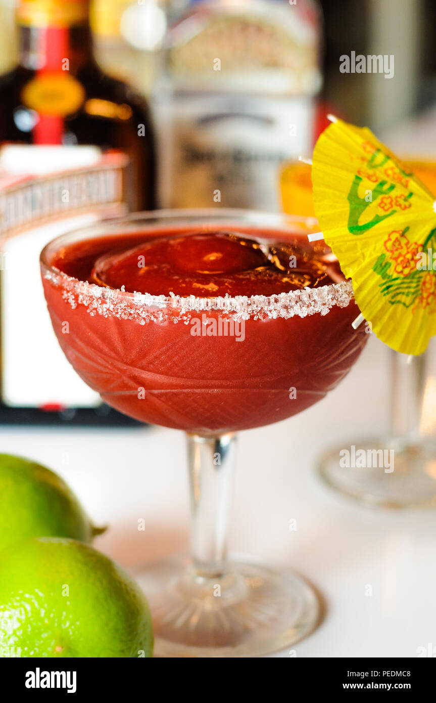 Strawberry frozen Martini / Daiquiri in front of blurred alcoholic ...