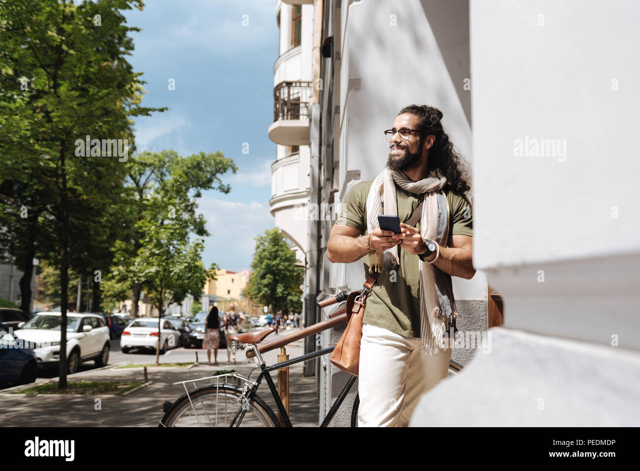 Positive joyful man looking at the street Stock Photo - Alamy