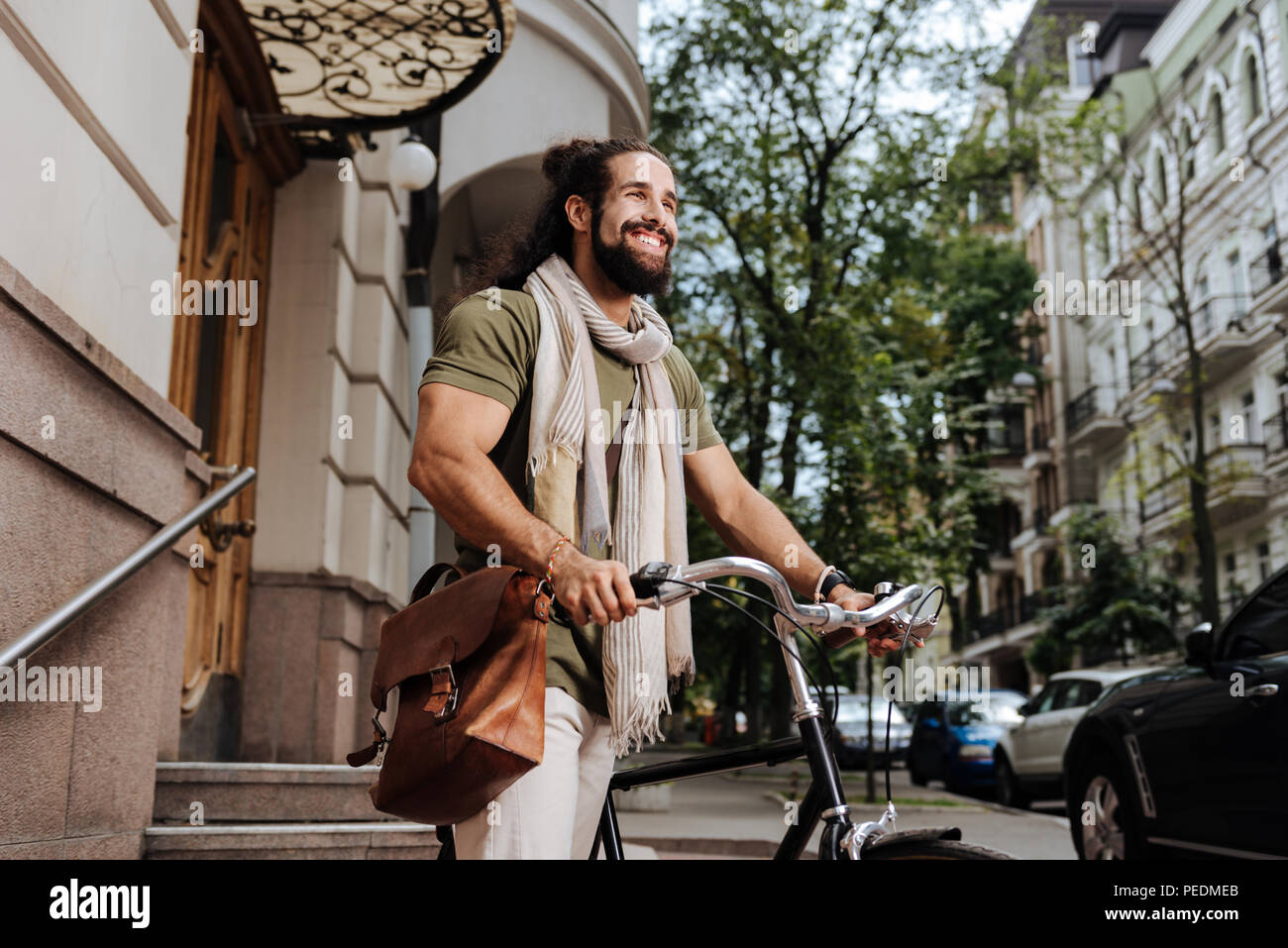 Joyful positive man smiling Stock Photo - Alamy