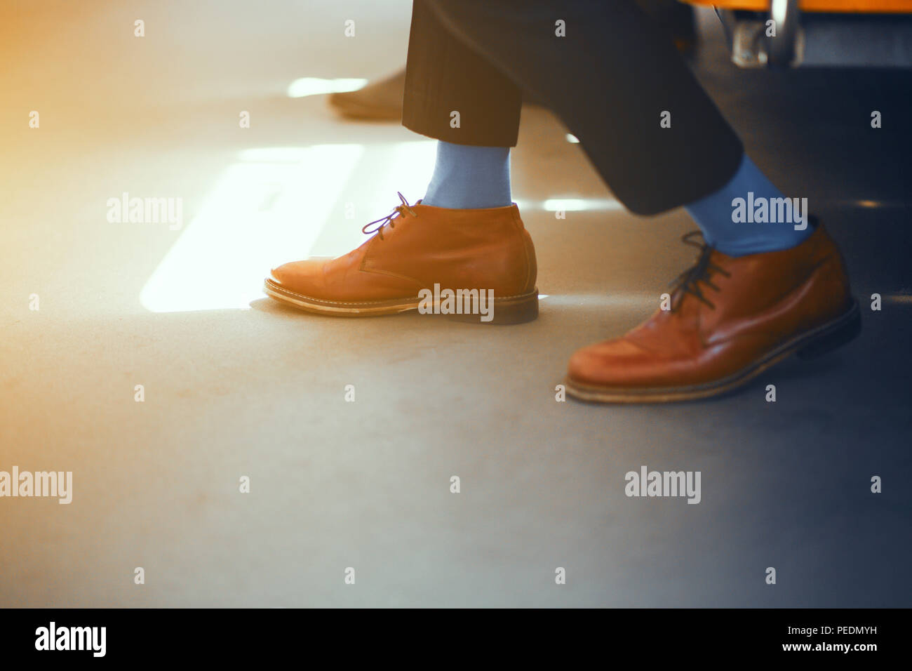 Feet of businessman at metro station Stock Photo - Alamy