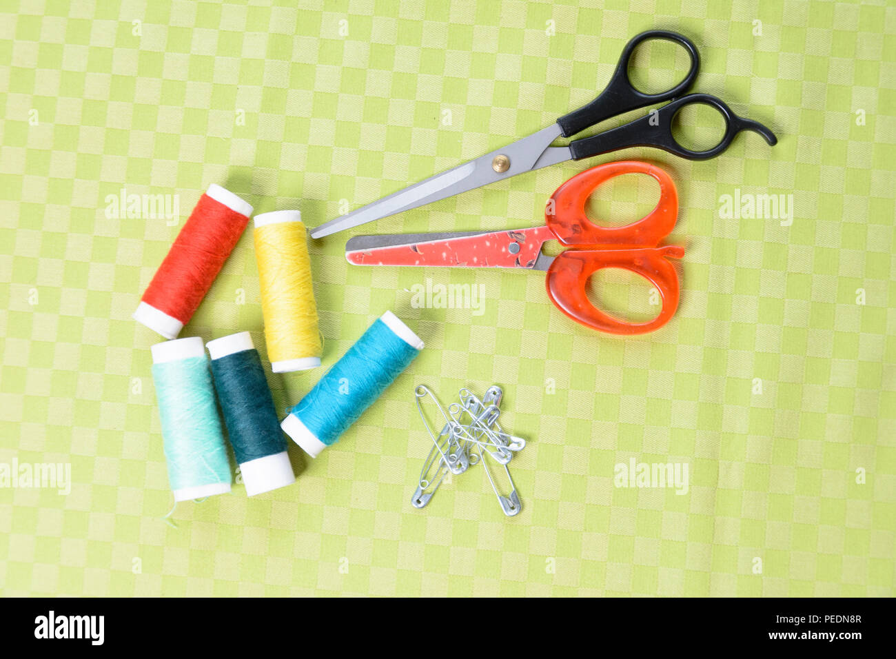 Scissors and threads on fabric, top view Tailoring equipment 2018 Stock ...