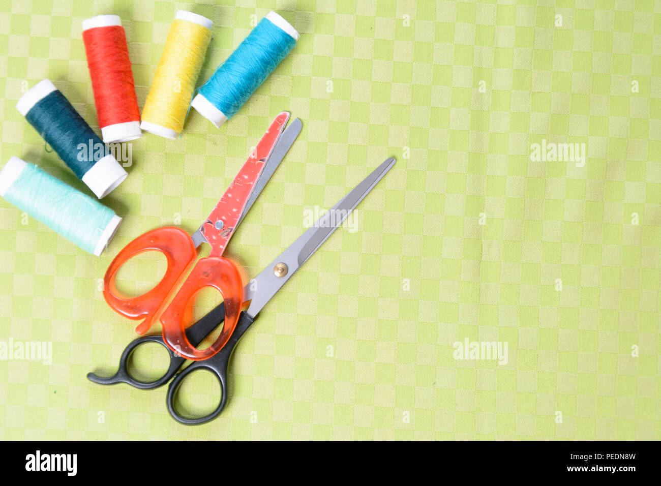 Scissors and threads on fabric, top view Tailoring equipment 2018 Stock ...