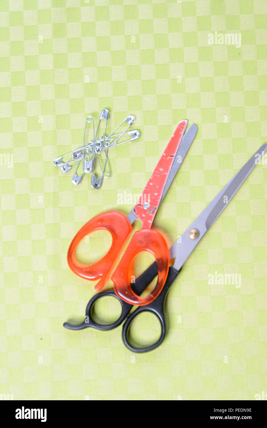 Scissors and threads on fabric, top view Tailoring equipment 2018 Stock ...