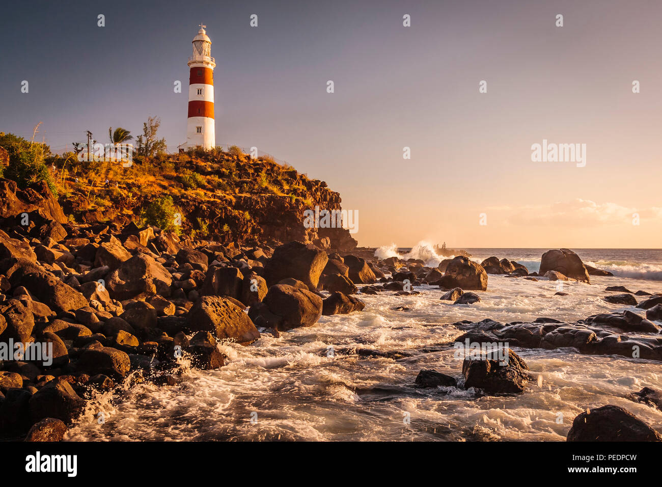 The old lighthouse of Pointe aux Caves on the cliffs of Albion ...