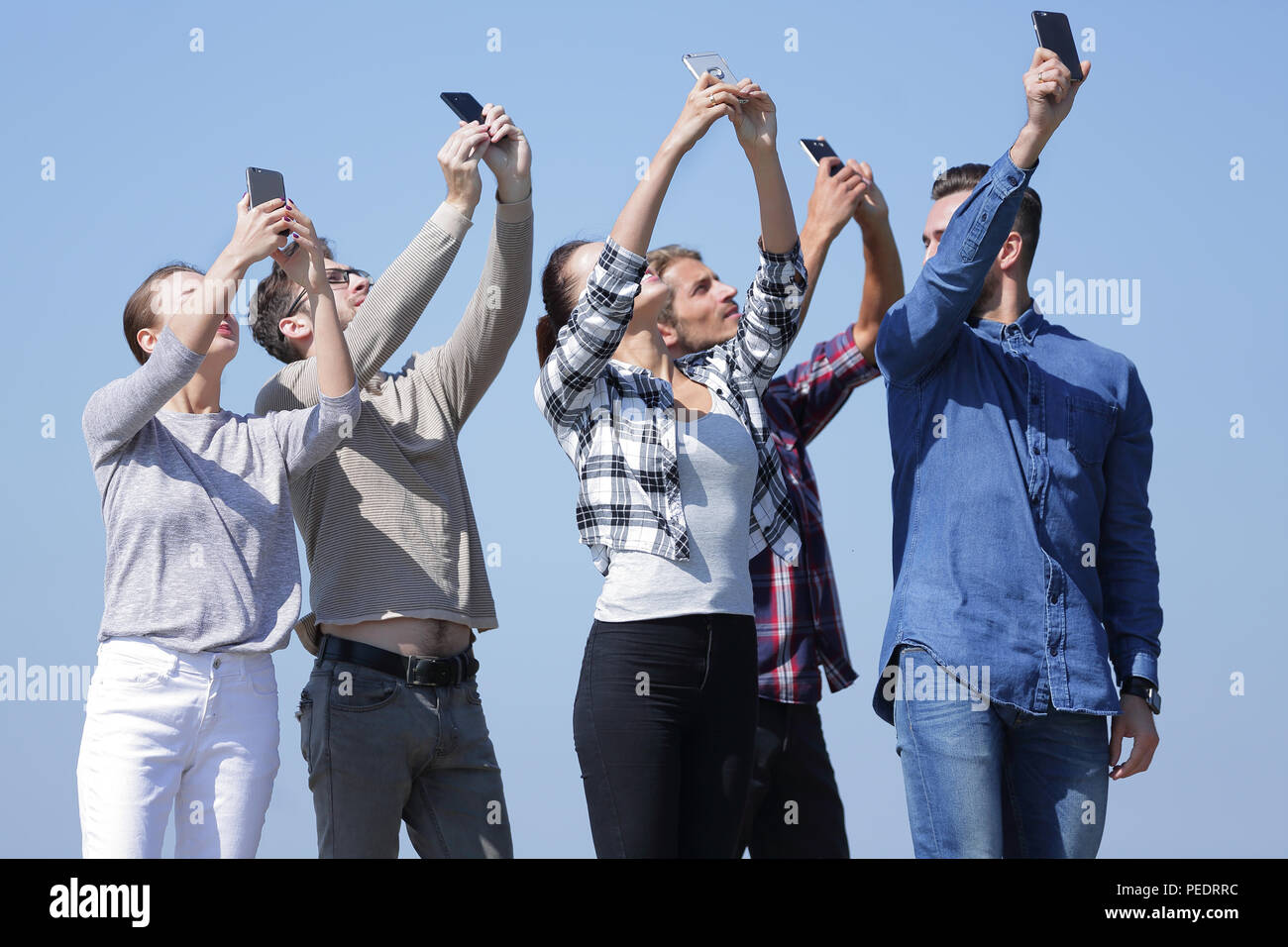 group of young people with smartphones Stock Photo - Alamy
