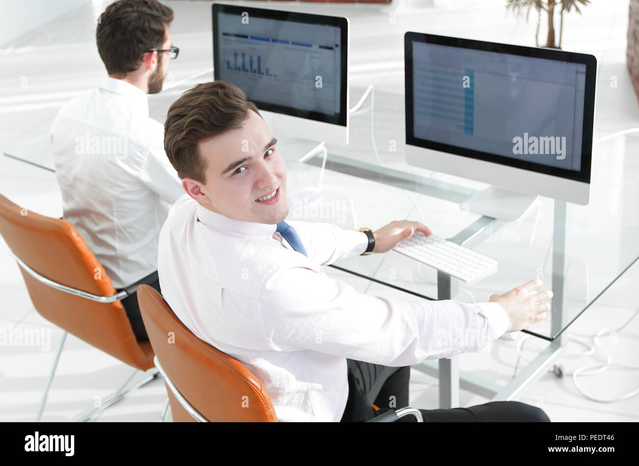Boss sitting behind desk employees hi-res stock photography and images ...