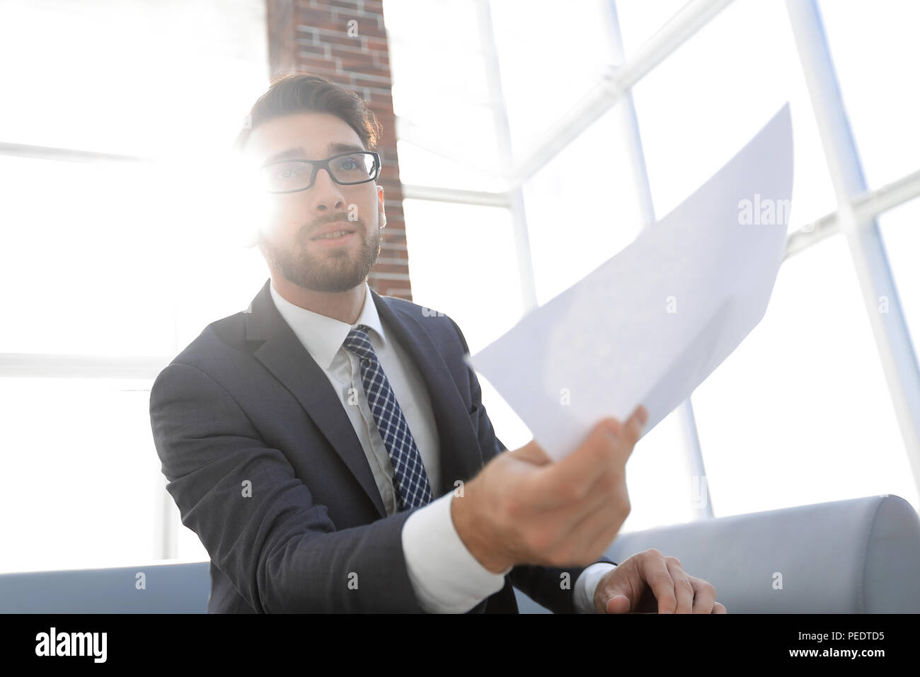 Image of business man holding paper Stock Photo - Alamy