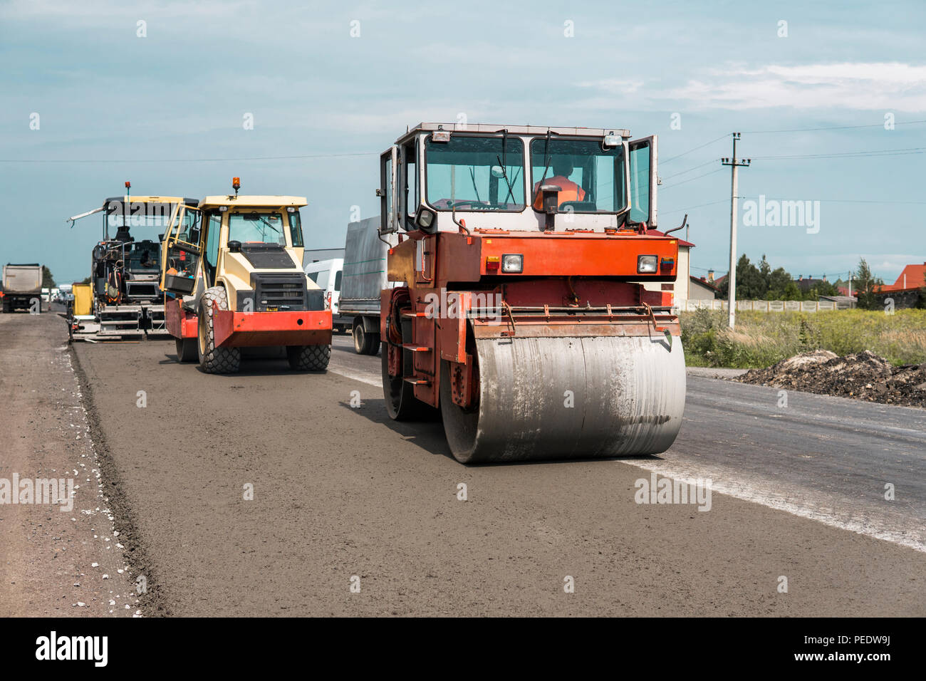 Orange Heavy Vibration roller compactor at asphalt pavement works for ...