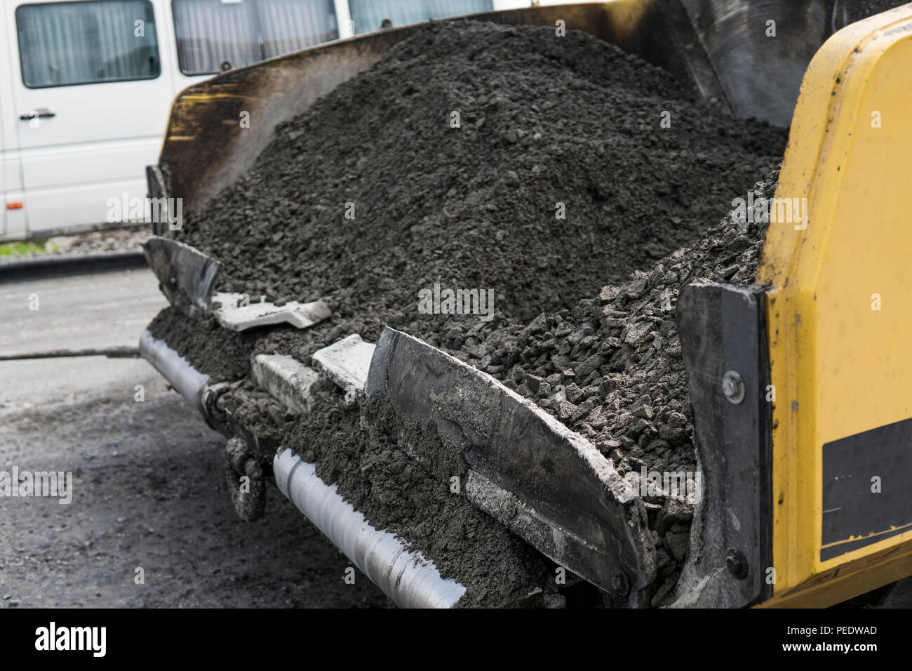 Details of Asphalt paver machine during road construction and repairing ...