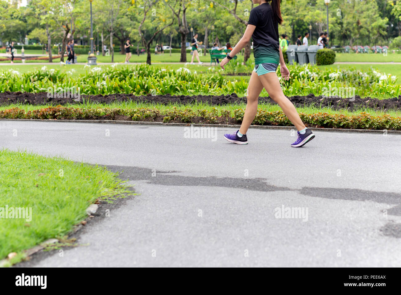 Asian woman legs doing exercise walking in the park in summer Stock ...