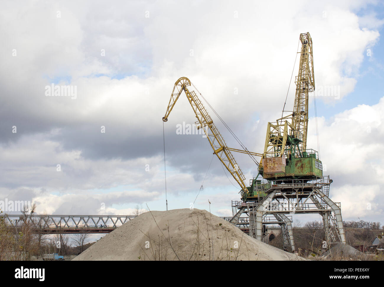 Gantry crane with a gripper, lifting crane Stock Photo - Alamy