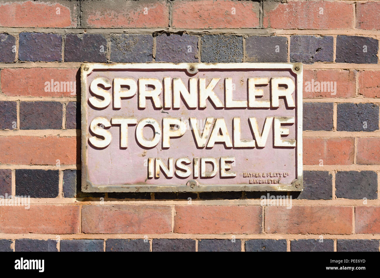 Old Mather & Platt fire safety sign saying "sprinkler stop valve inside ...
