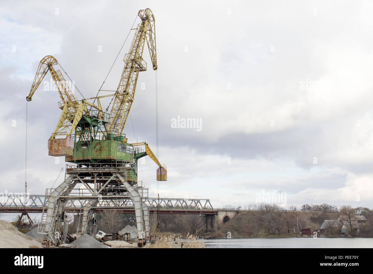 Gantry crane with a gripper, lifting crane Stock Photo - Alamy