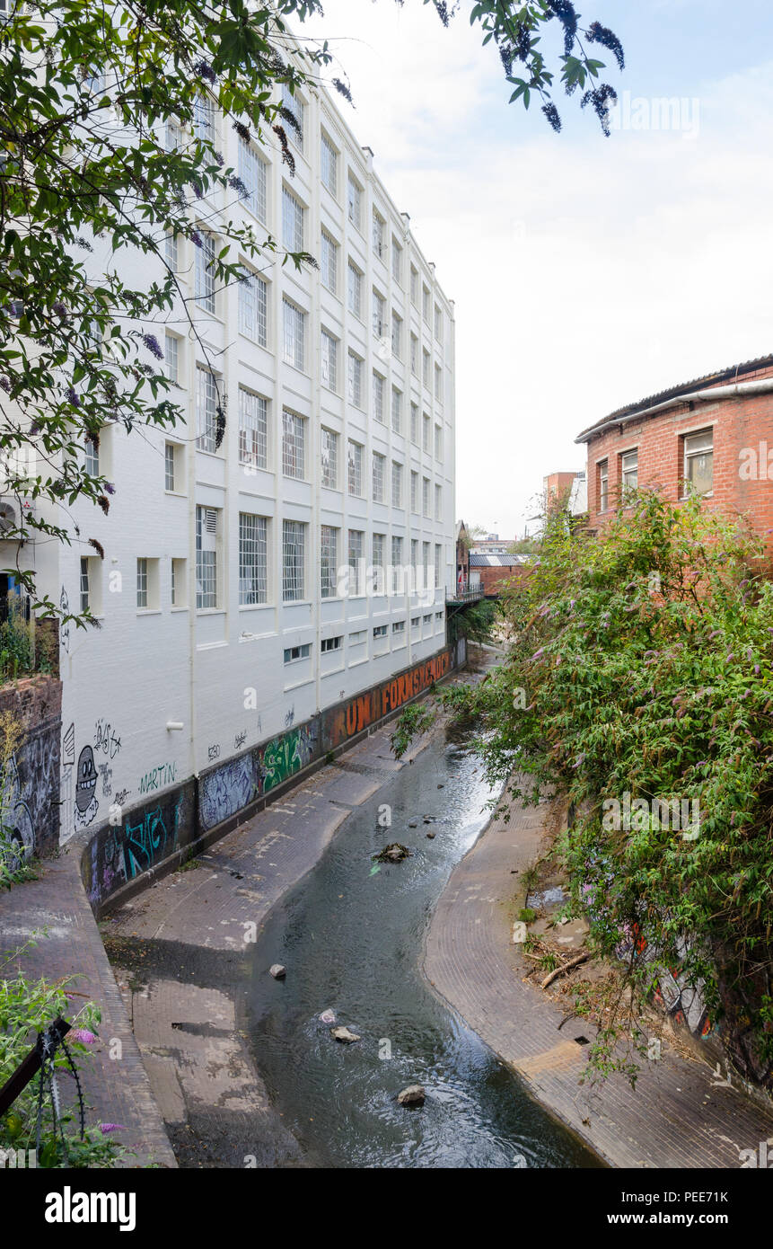 Railway viaduct running over the River Rea in Digbeth near the Custard ...