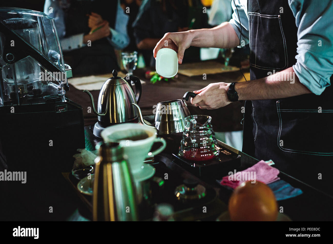 championship among coffee houses, members of teams show barista's skill ...