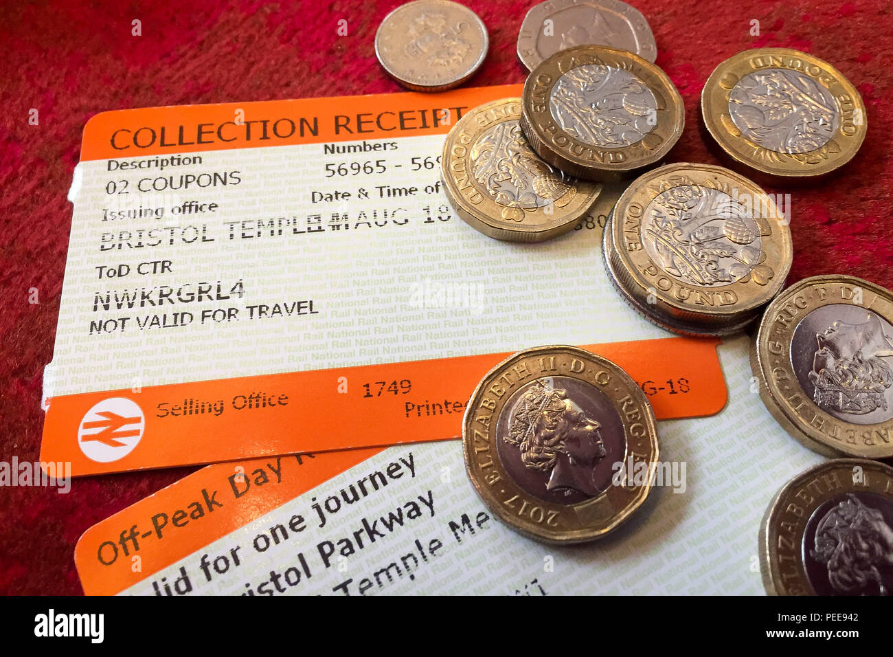 Off-peak day return rail tickets and money Stock Photo - Alamy
