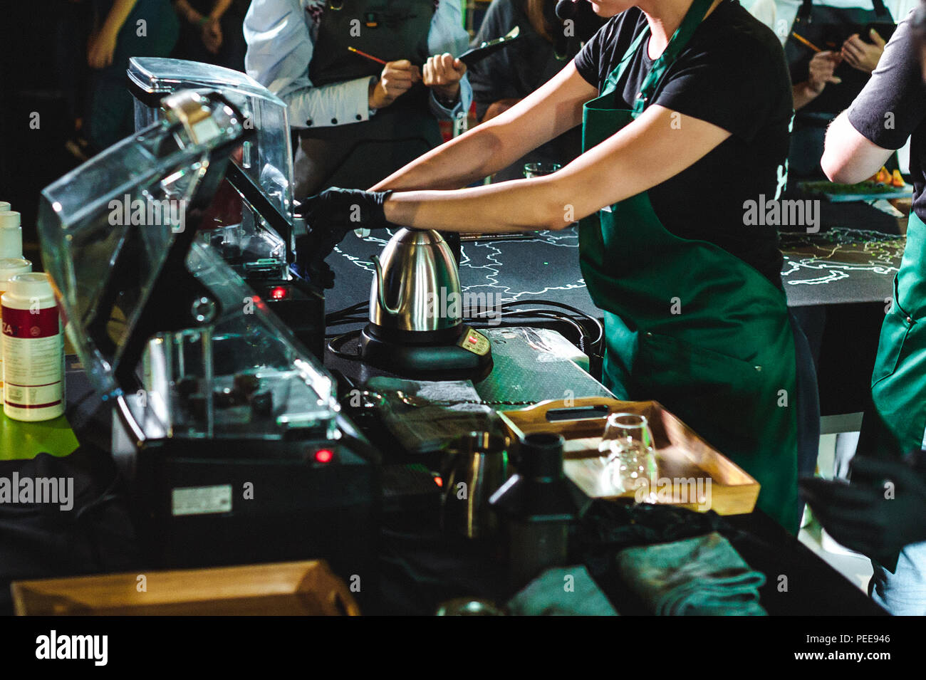 championship among coffee houses, members of teams show barista's skill ...