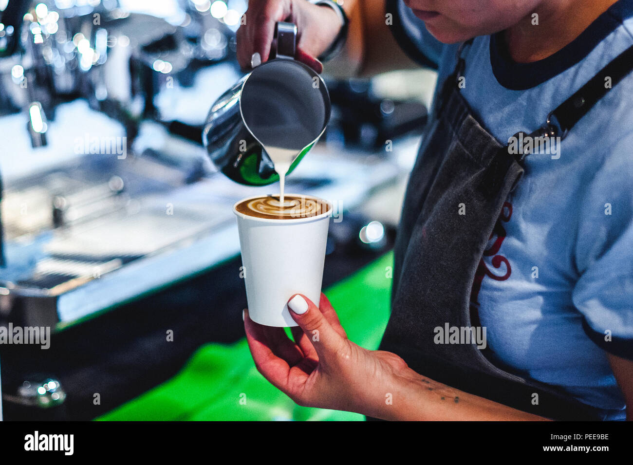 championship among coffee houses, members of teams show barista's skill ...