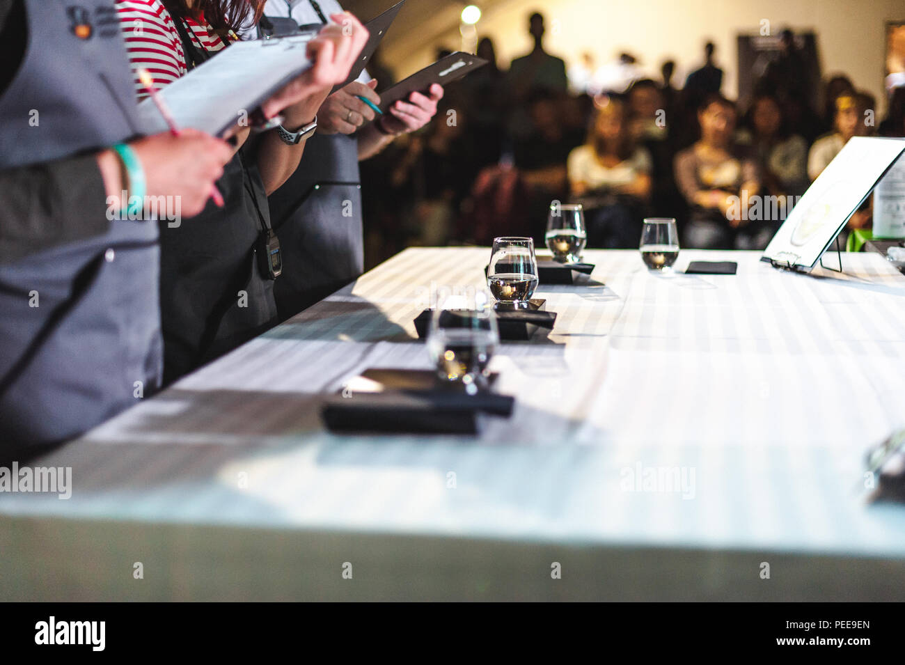 business woman makes notes on a sheet in a notebook, at a restaurant ...