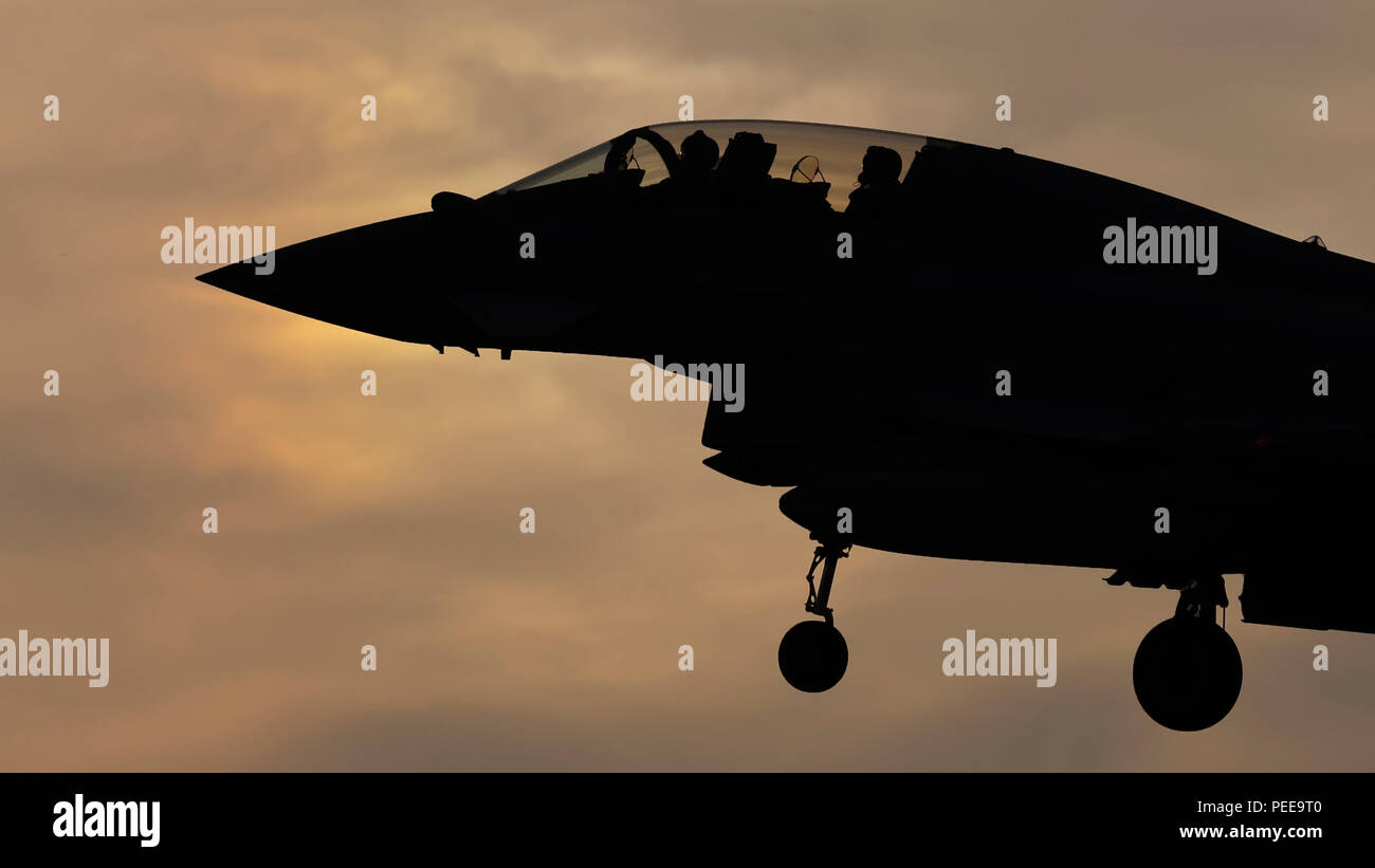 Sunset silhouette Typhoon on finals at RAF Coningsby Stock Photo - Alamy