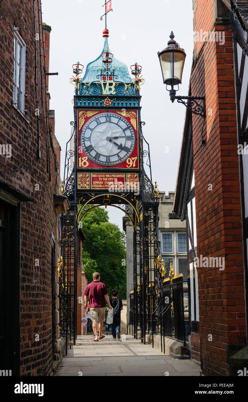 Chester, UK: Aug 6, 2018: Tourists walk underneath the Eastgate clock ...