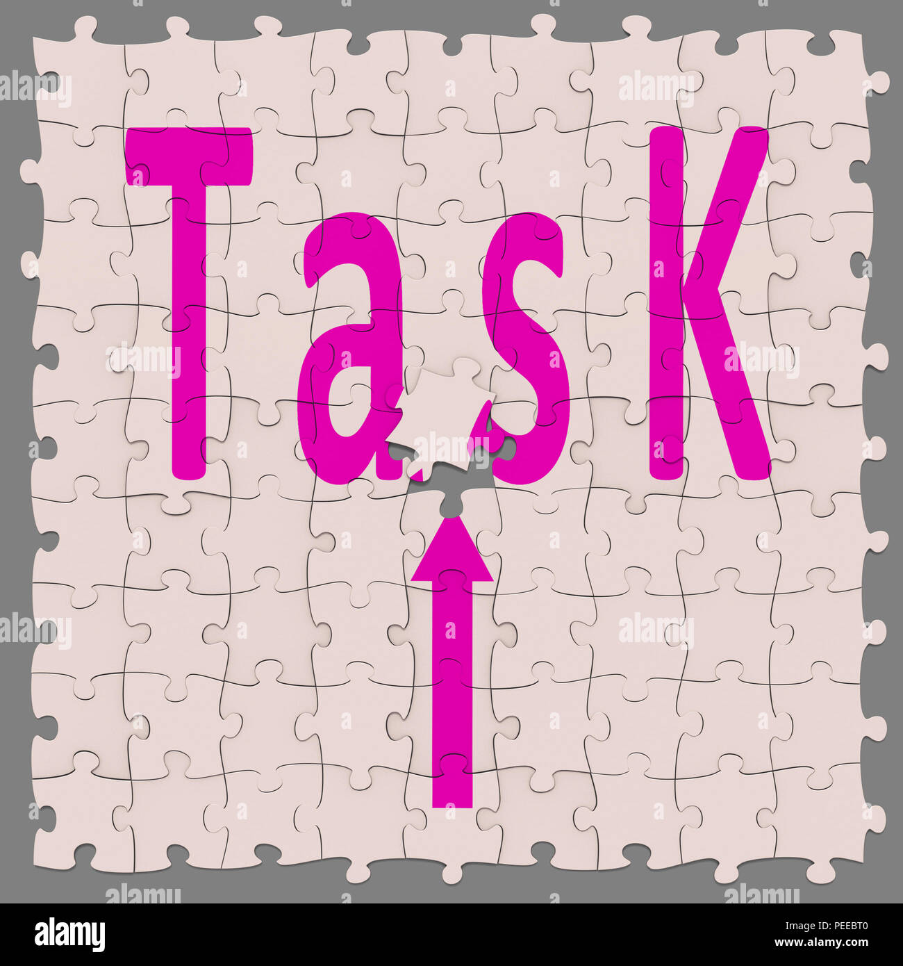 Cardboard jigsaw puzzles with red motivation text "Task" assembled on ...