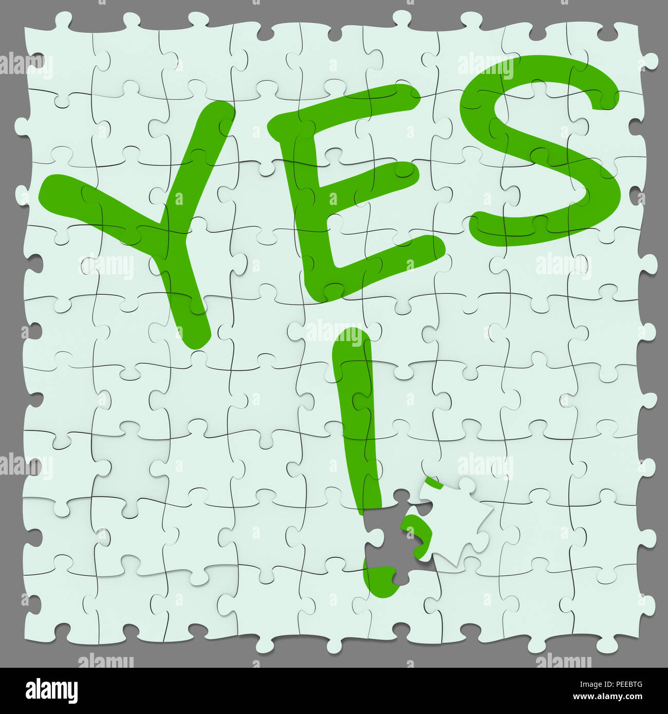 Cardboard jigsaw puzzles with red text "yes" assembled on white ...