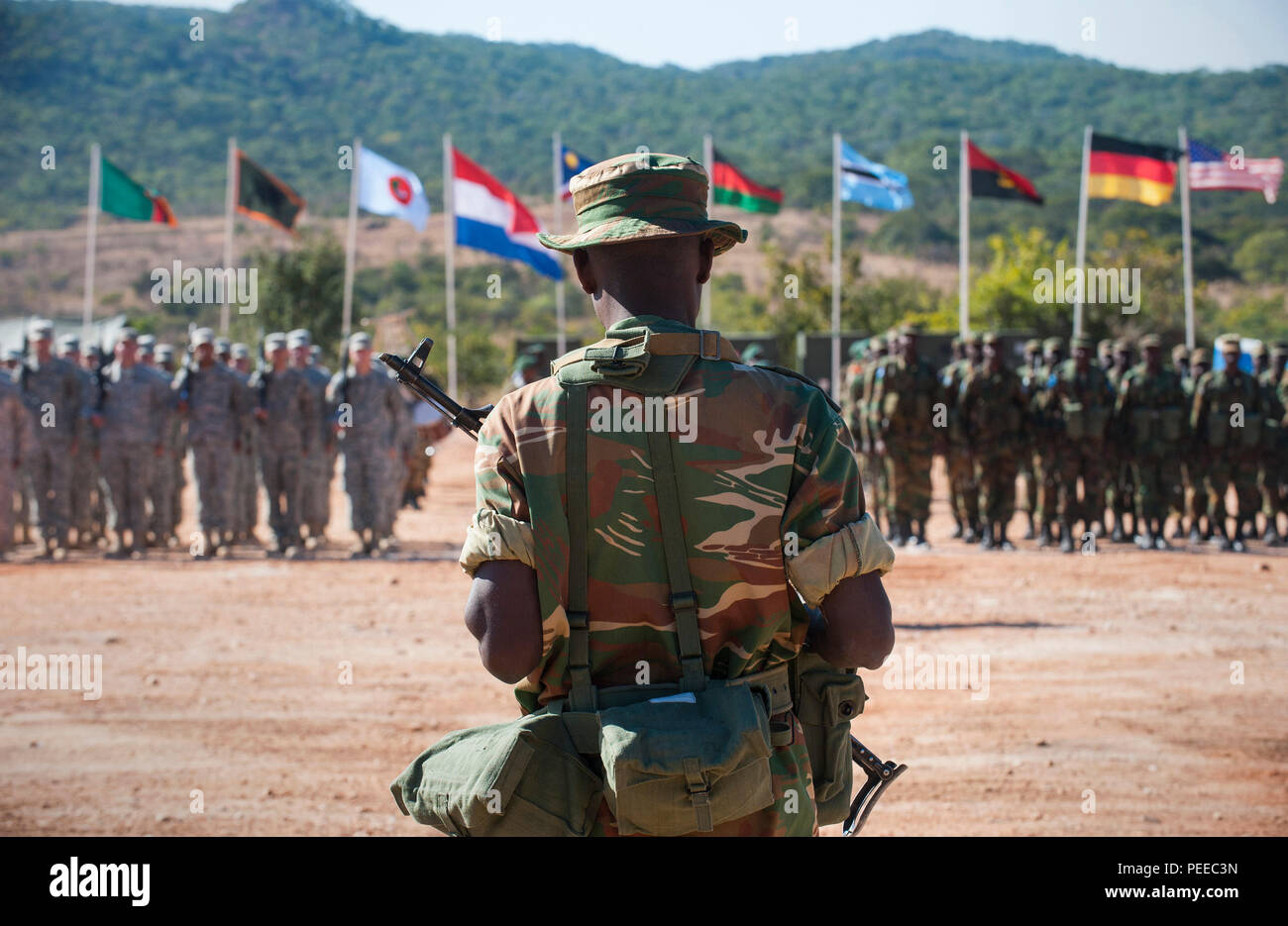 A member of the Zambian Defense force prepares to assume command of a ...