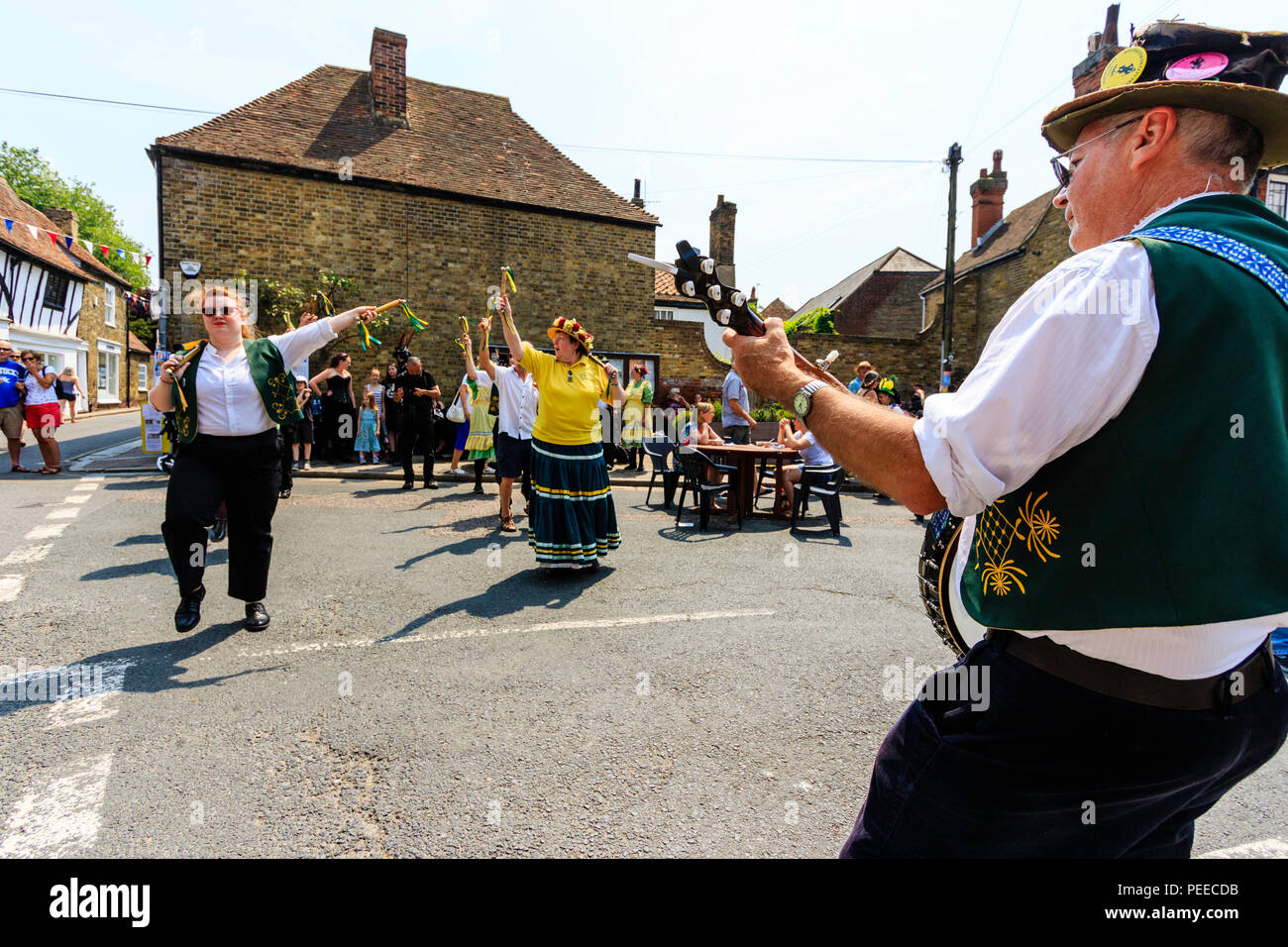 Traditional English folk dancers, the Bishop Gundulf's dance side, with ...