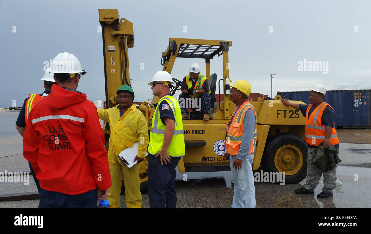 Coast Guard crew members conduct a daily site safety brief and ...