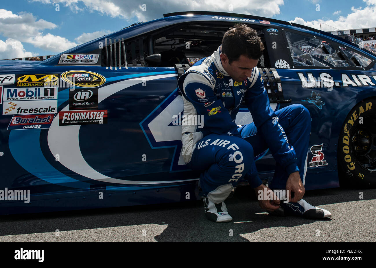Aric Almirola, No. 43 car driver laces his shoes before climbing into ...