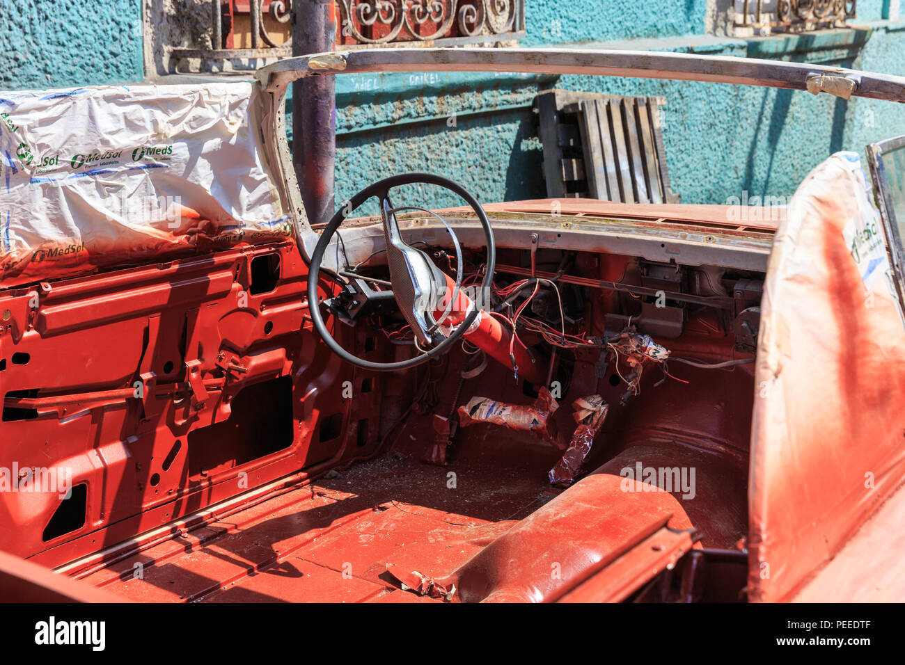 Old American classic car wreck, gutted interior being restored and re ...
