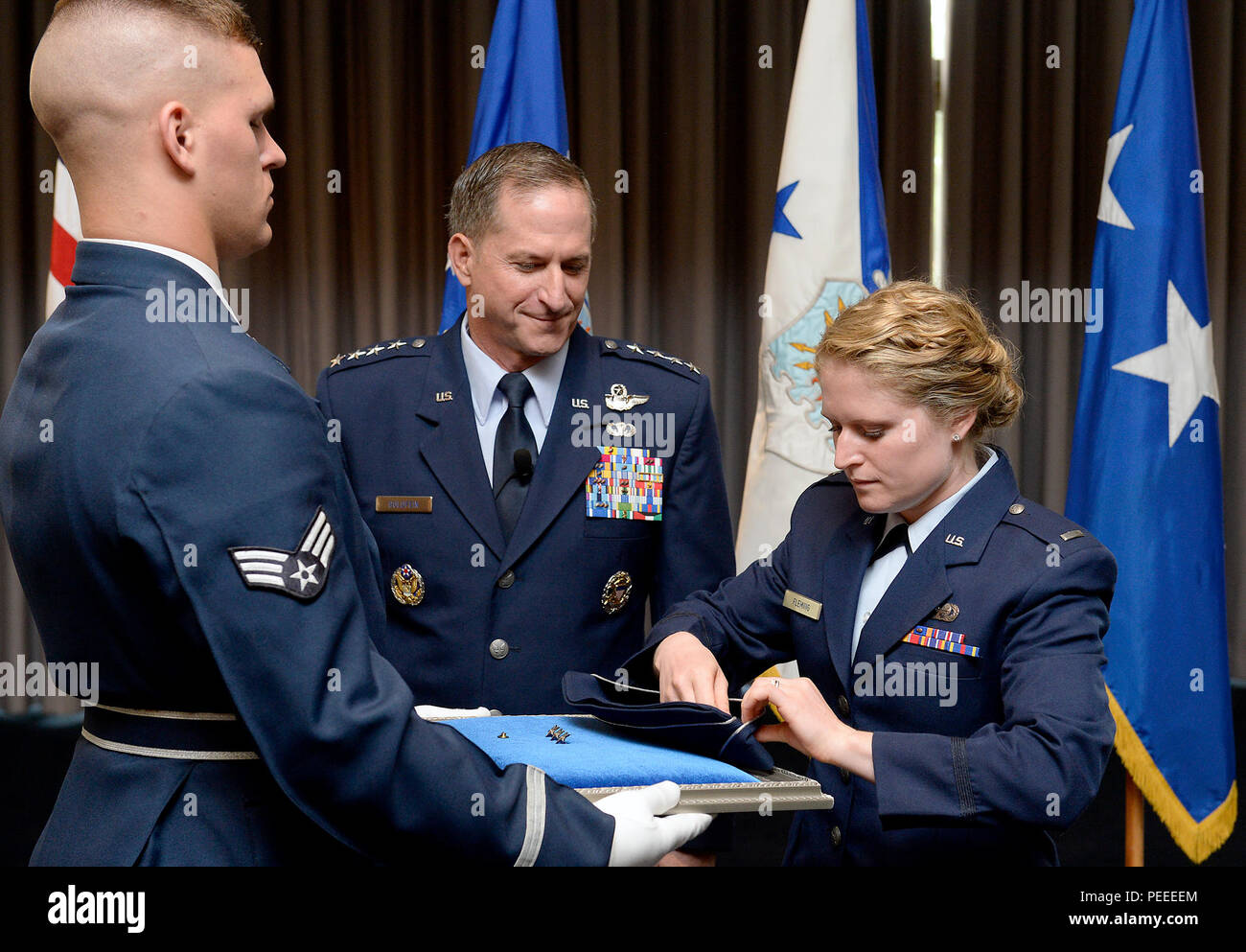 The rank of general is pinned on David L. Goldfein's flight cap by his ...