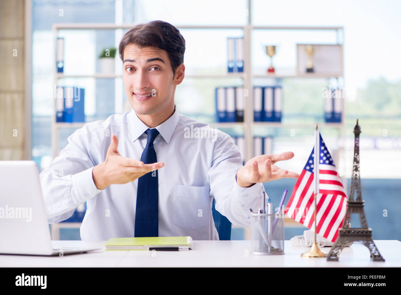 Sales agent working in travel agency Stock Photo - Alamy