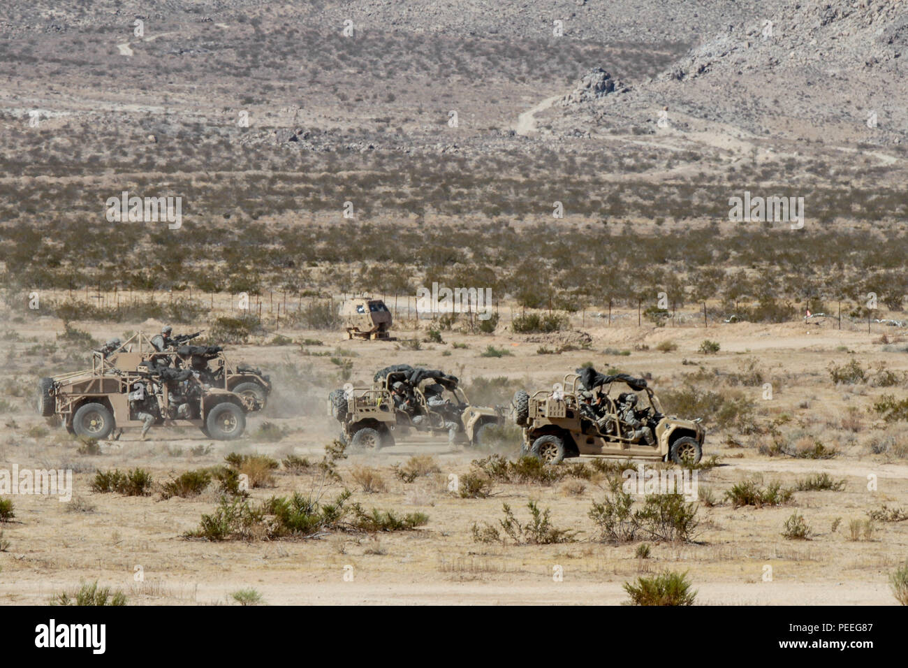 Ultra-lightweight combat vehicles bearing paratroopers assigned to the ...