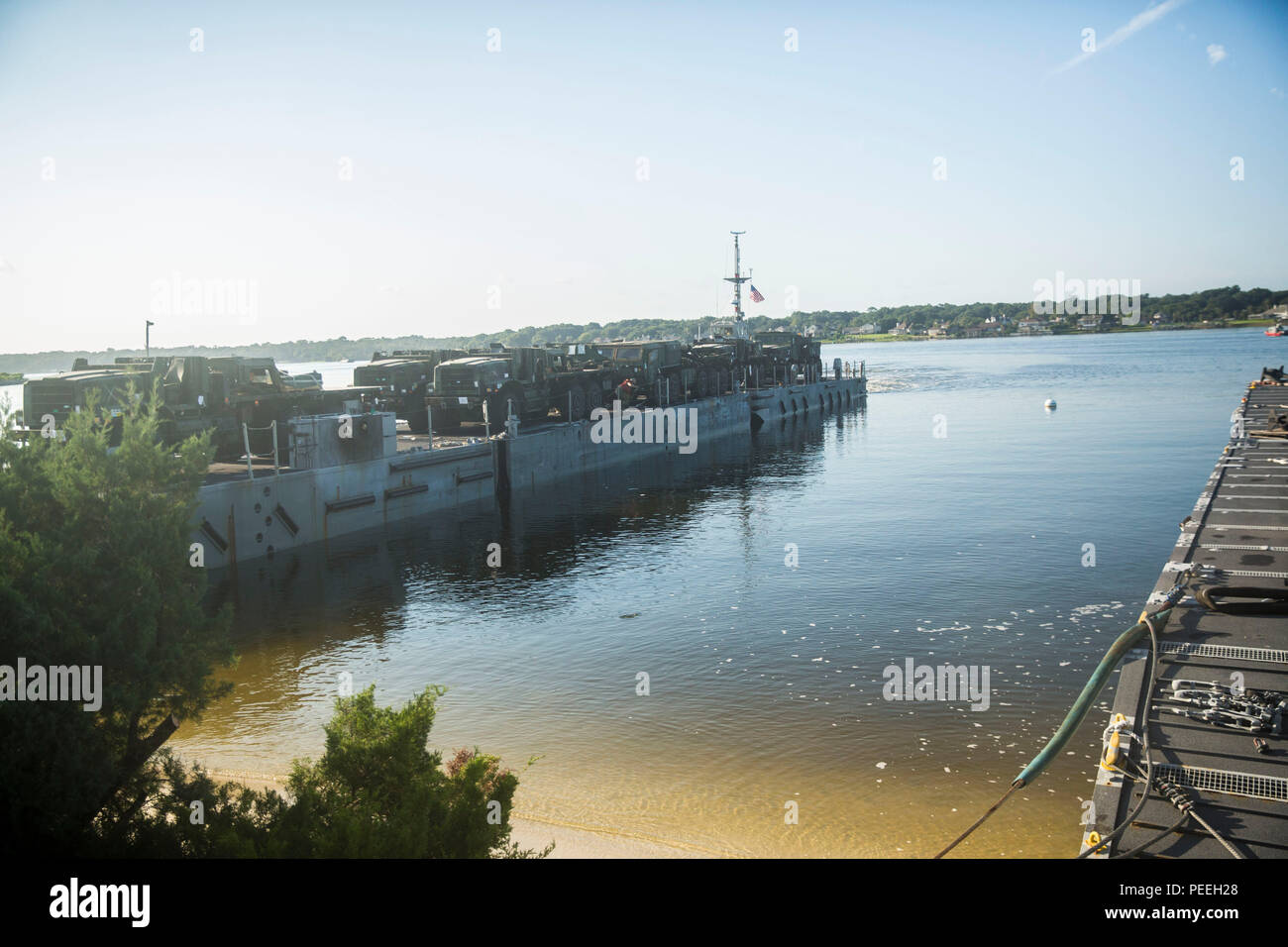 An Improved Navy Lighterage System loaded with vehicles from the USNS ...