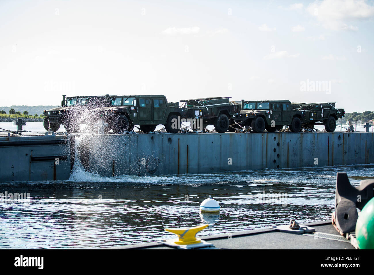 An Improved Navy Lighterage System loaded with vehicles from a recent ...