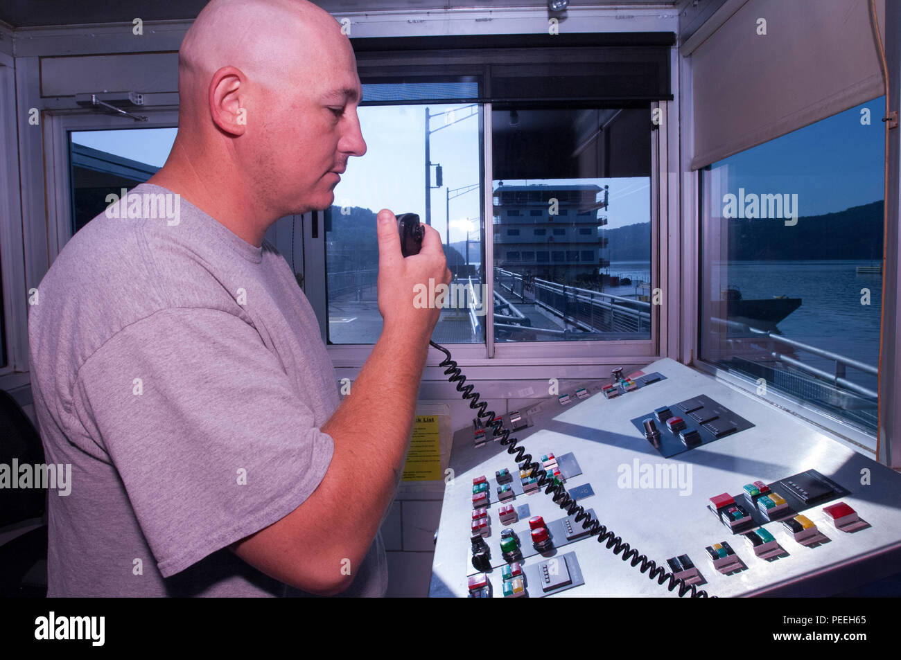 Lock operator Brandon Smith communicates with the Motor Vessel ...