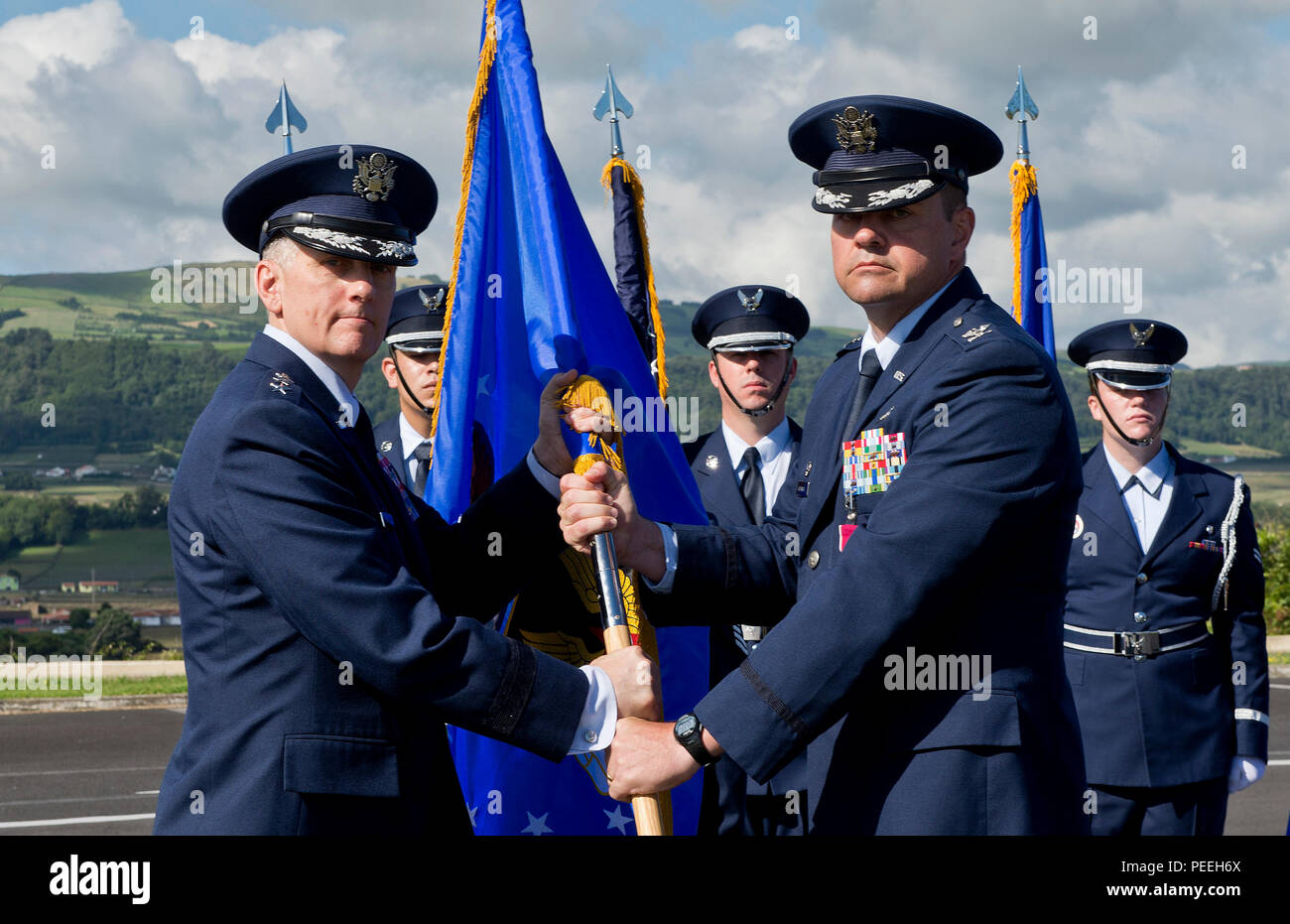Col. Martin Rothrock, commander of the 65th Air Base Wing, passes the ...