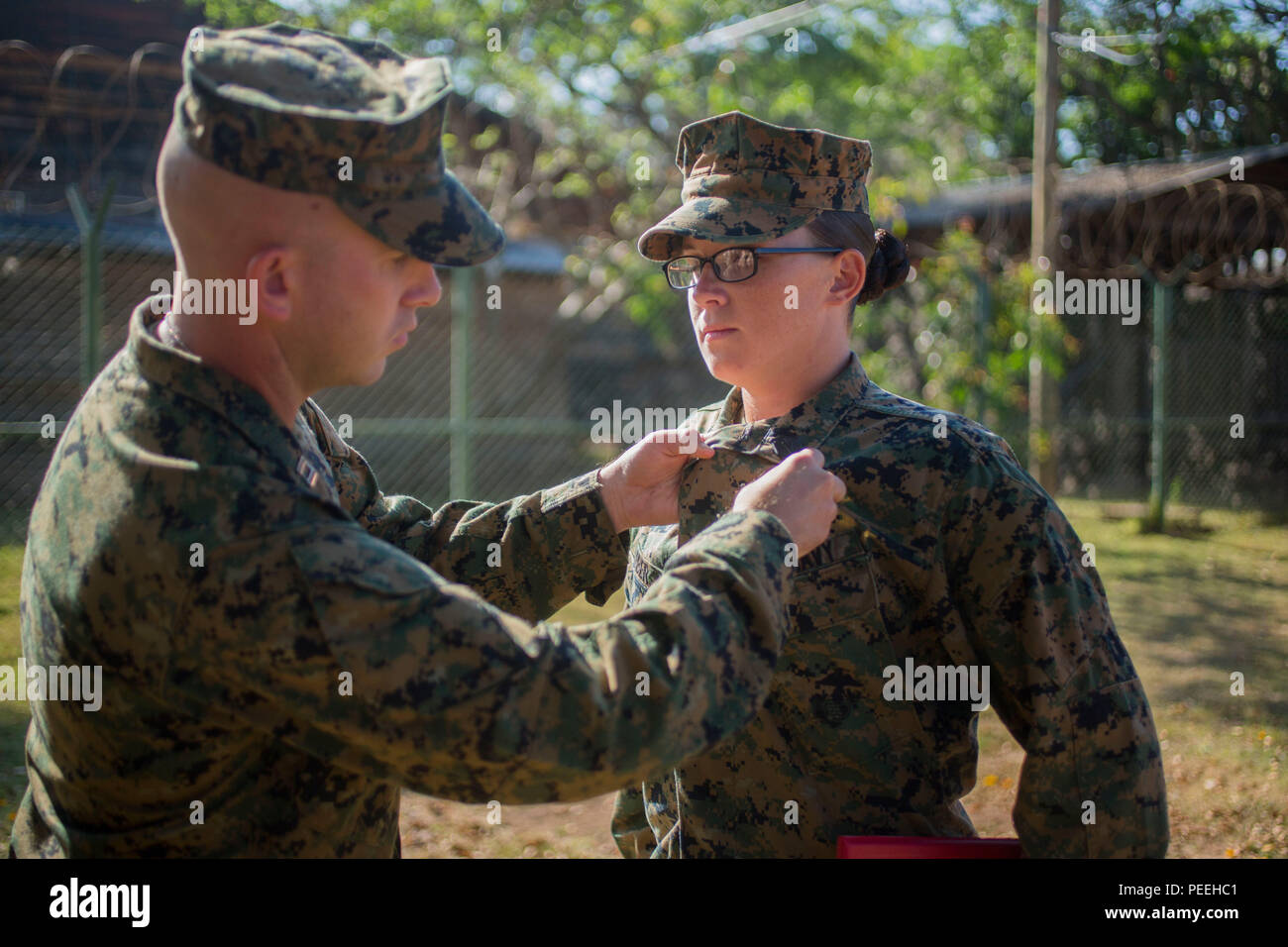 U.S. Marine Corps Capt. Eric D. Cramer, left, combat engineer officer ...
