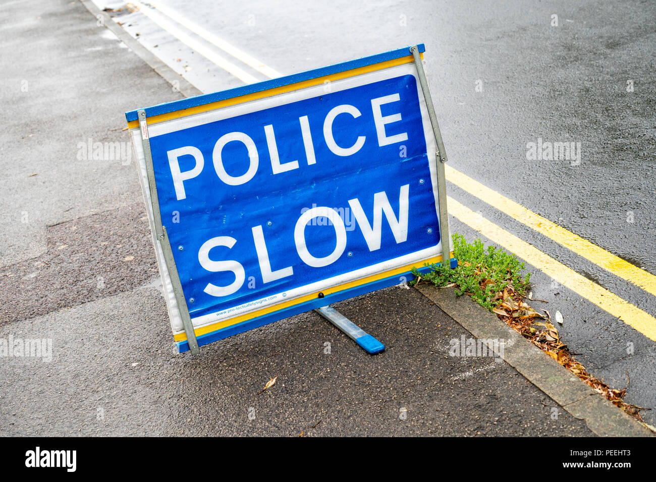 Blue Police slow sign Stock Photo - Alamy
