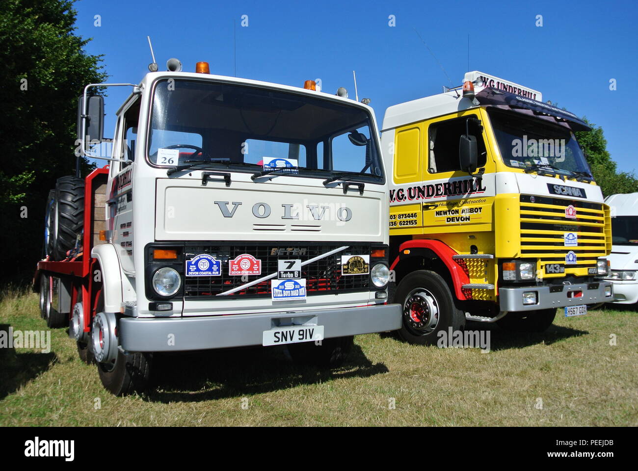 a 1979 Volvo F7-31 Beavertail lorry (right) parked next to a 1990 ...