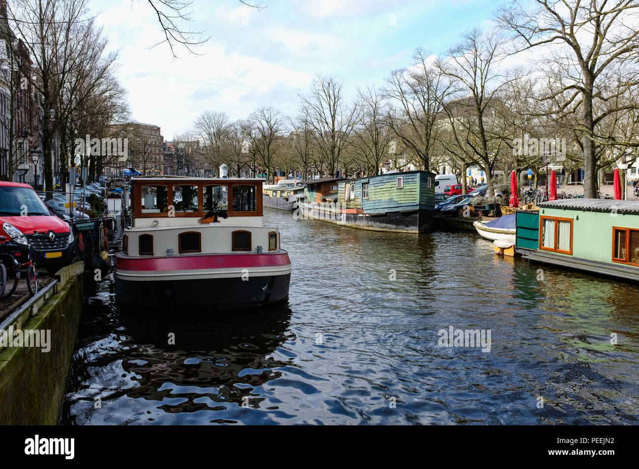 Traditional old buildings and and boats in Amsterdam, . Canals of ...