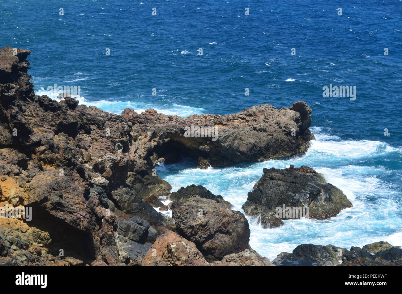 Aruba's rock bridge on the southern tip made of lava rock Stock Photo ...