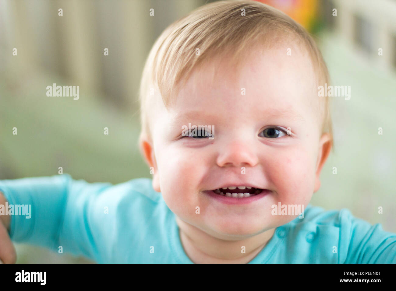 Small child, baby smiles with a warm smile Stock Photo - Alamy