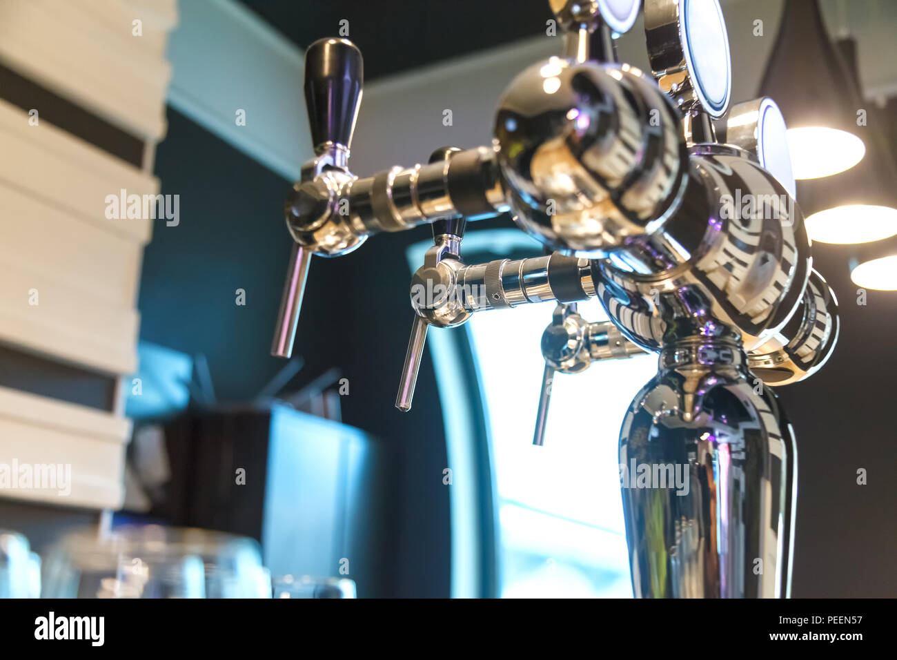 Crane defoamer for bottling beer installed on the bar in the restaurant ...