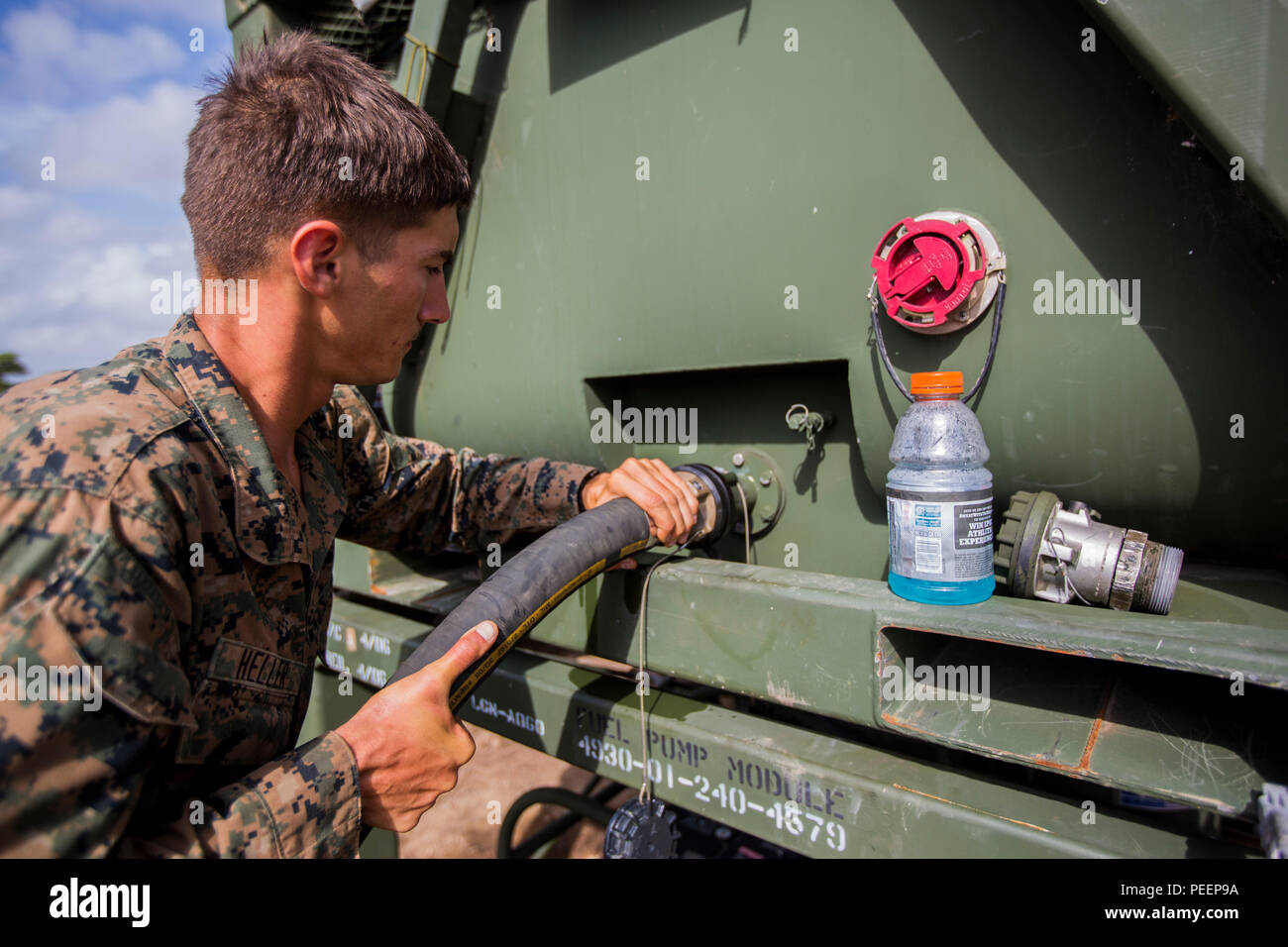 U.S. Marine Corps Lance Cpl. Derek Heller, a water purification ...